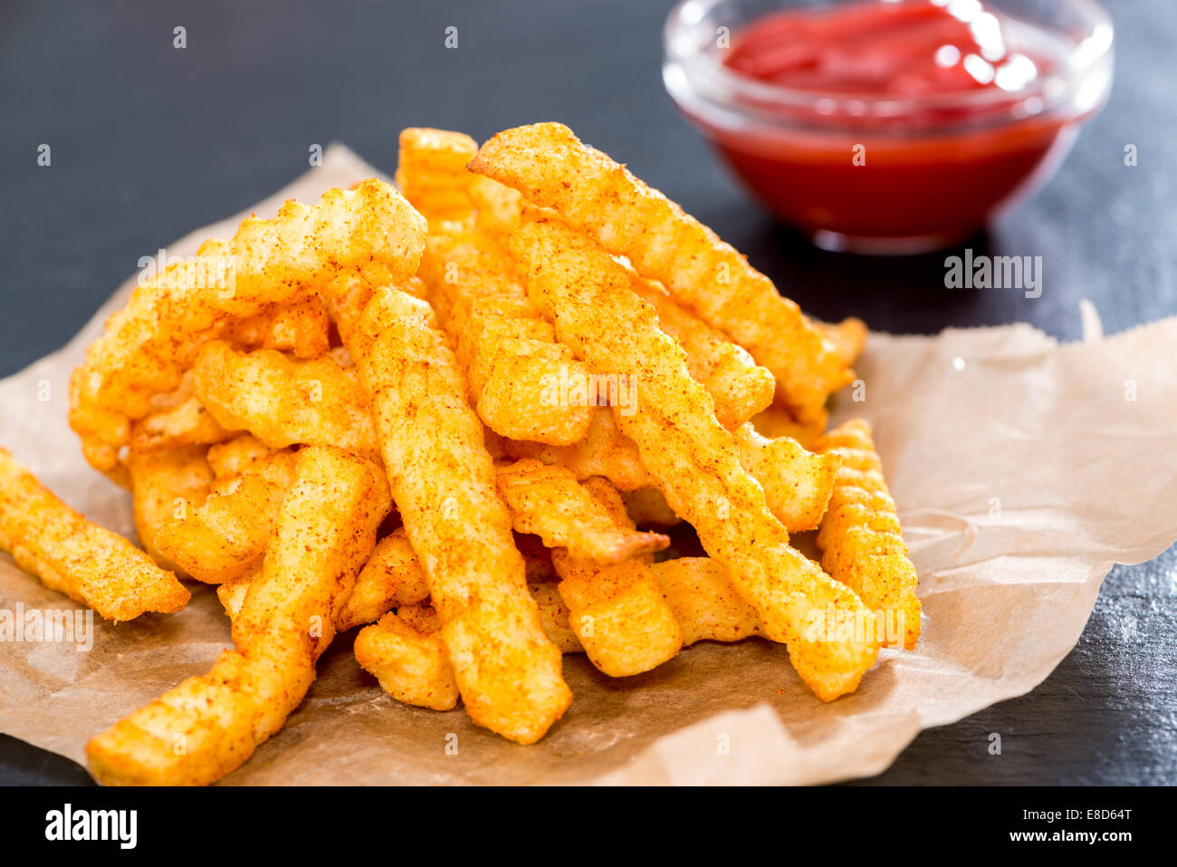 Portion of Chips on dark background (detailed close-up shot Stock Photo ...