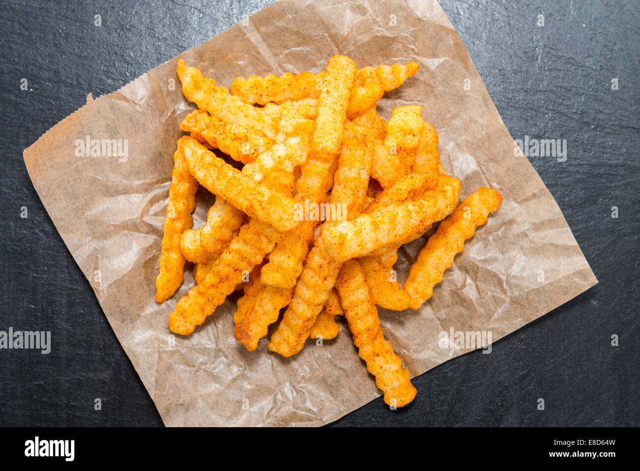 Portion of Chips on dark background (detailed close-up shot Stock Photo ...