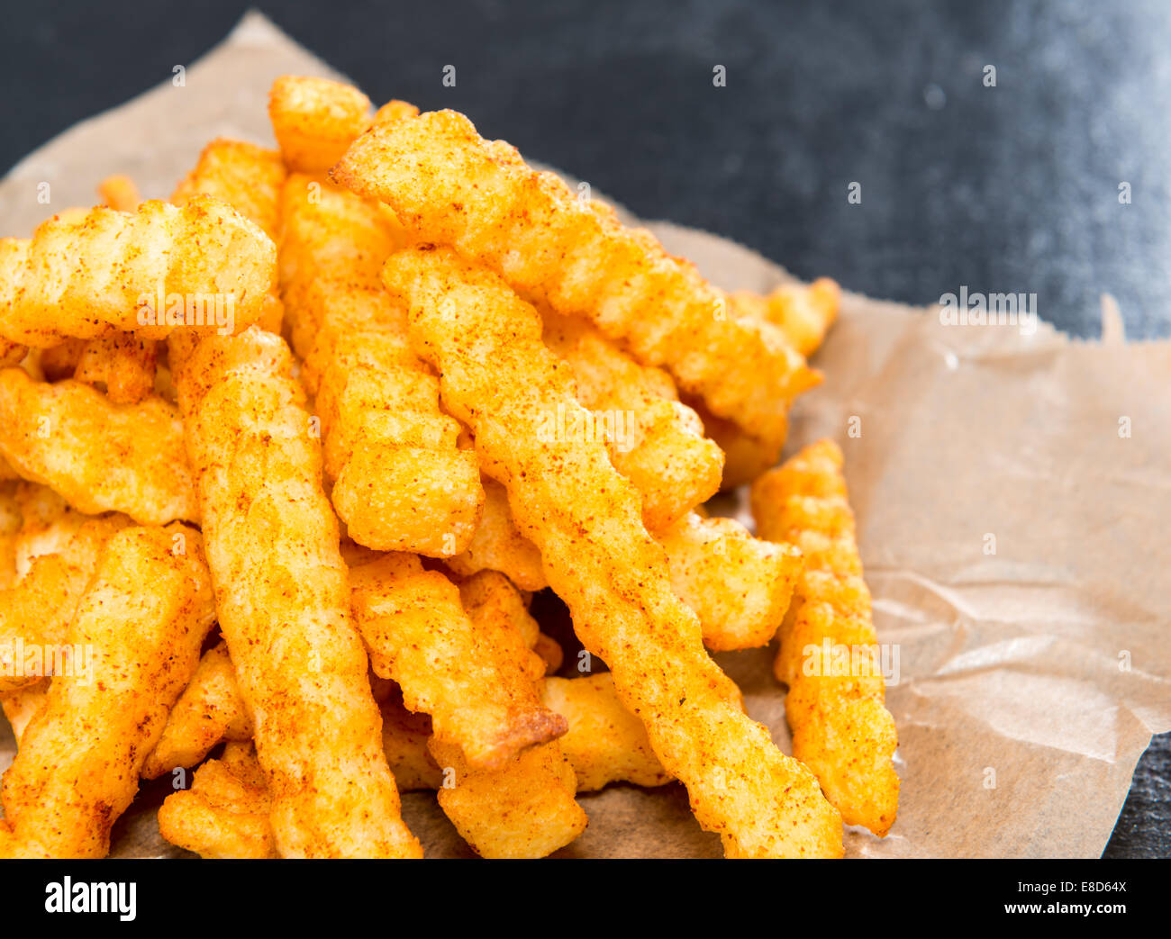 Portion of Chips on dark background (detailed close-up shot Stock Photo ...