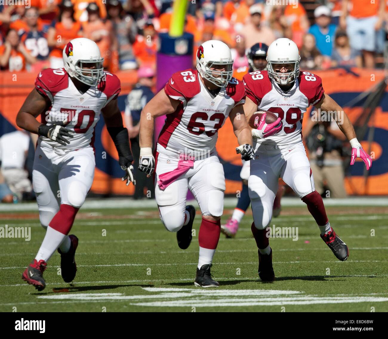 Denver, Colorado, USA. 5th Oct, 2014. Cardinals TE JOHN CARLSON, right ...