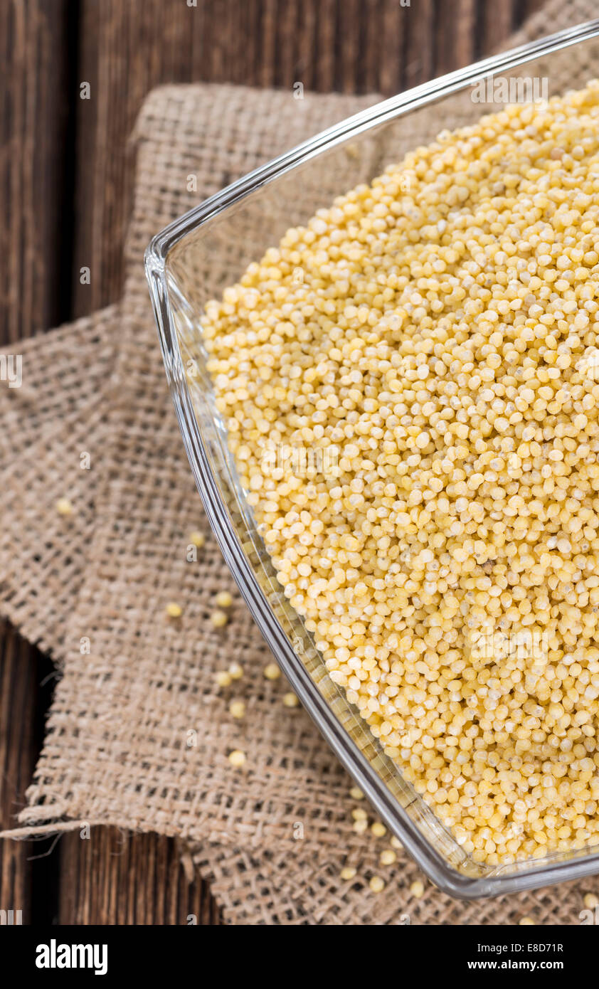 Millet (detailed close-up shot) on dark wooden background Stock Photo ...