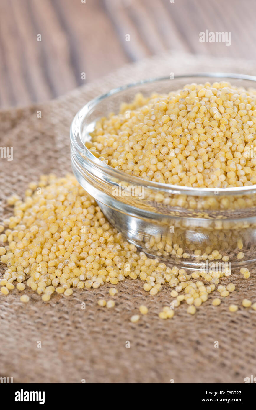 Portion of Millet on dark wooden background (close-up shot Stock Photo ...