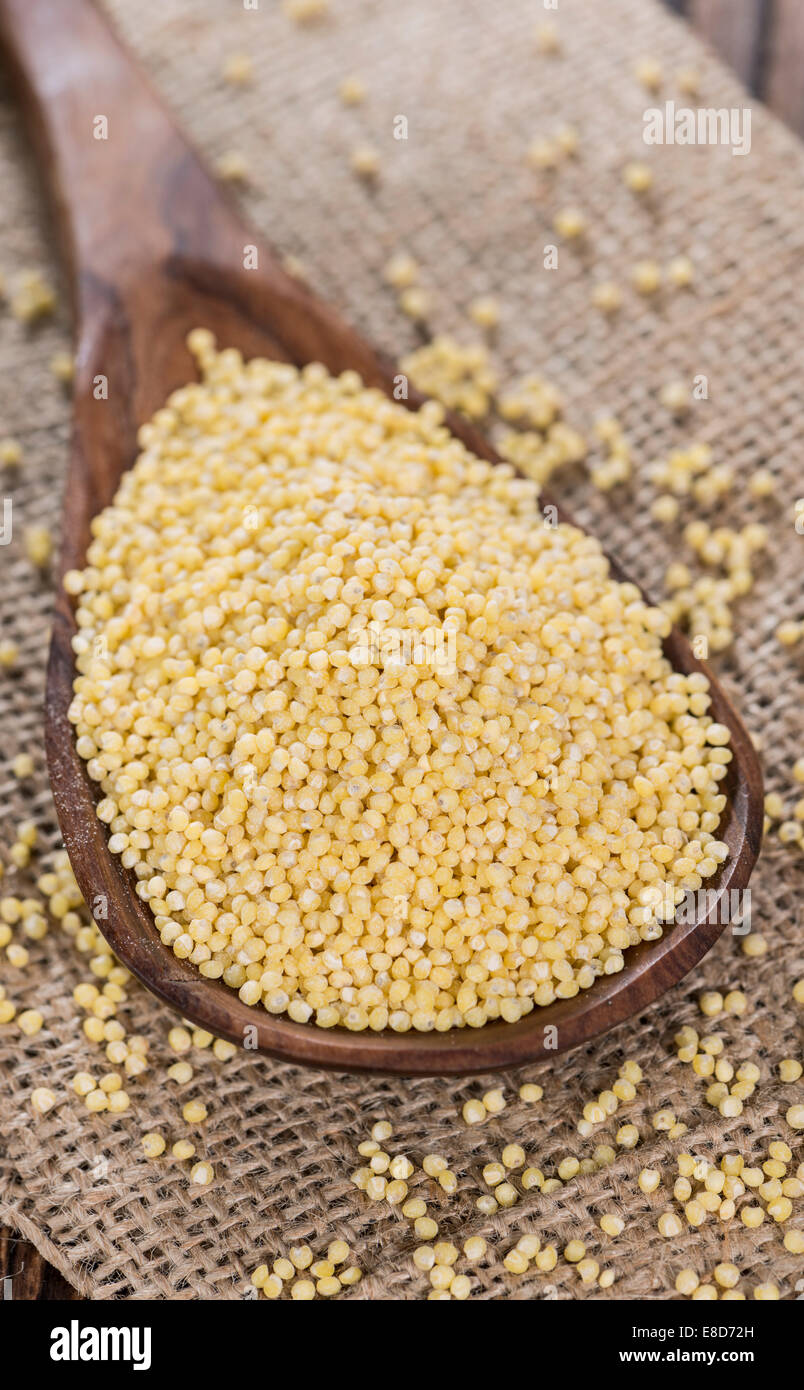 Millet (detailed close-up shot) on dark wooden background Stock Photo ...