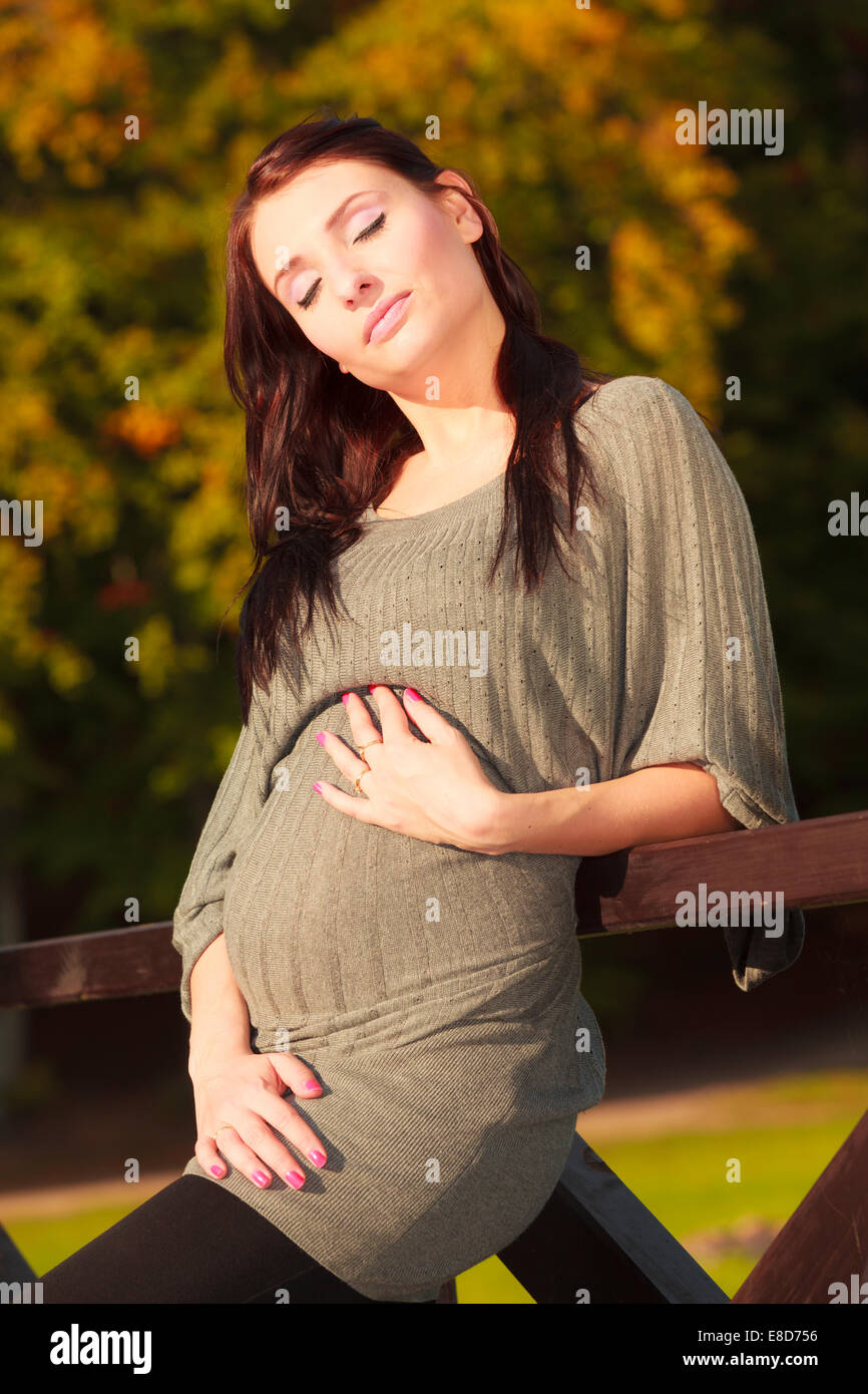Pregnancy, motherhood and happiness concept. Relaxed calm pregnant ...
