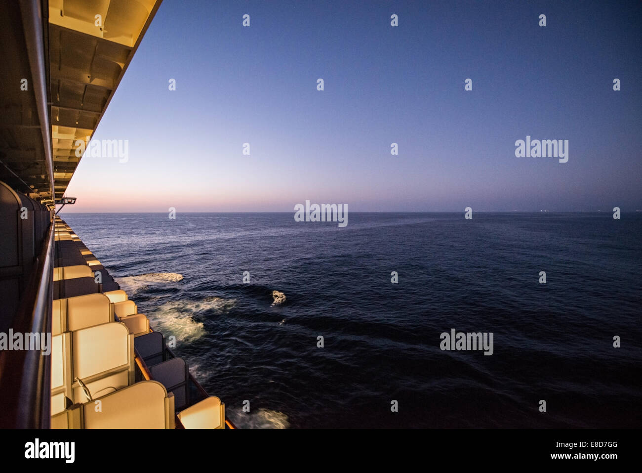 Looking out to the ocean during sunset from the balcony of a cruise ...