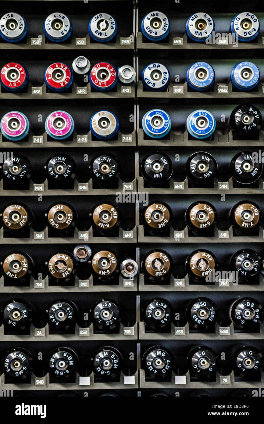 Professional Hair Coloring Bottles in a Rack Stock Photo - Alamy
