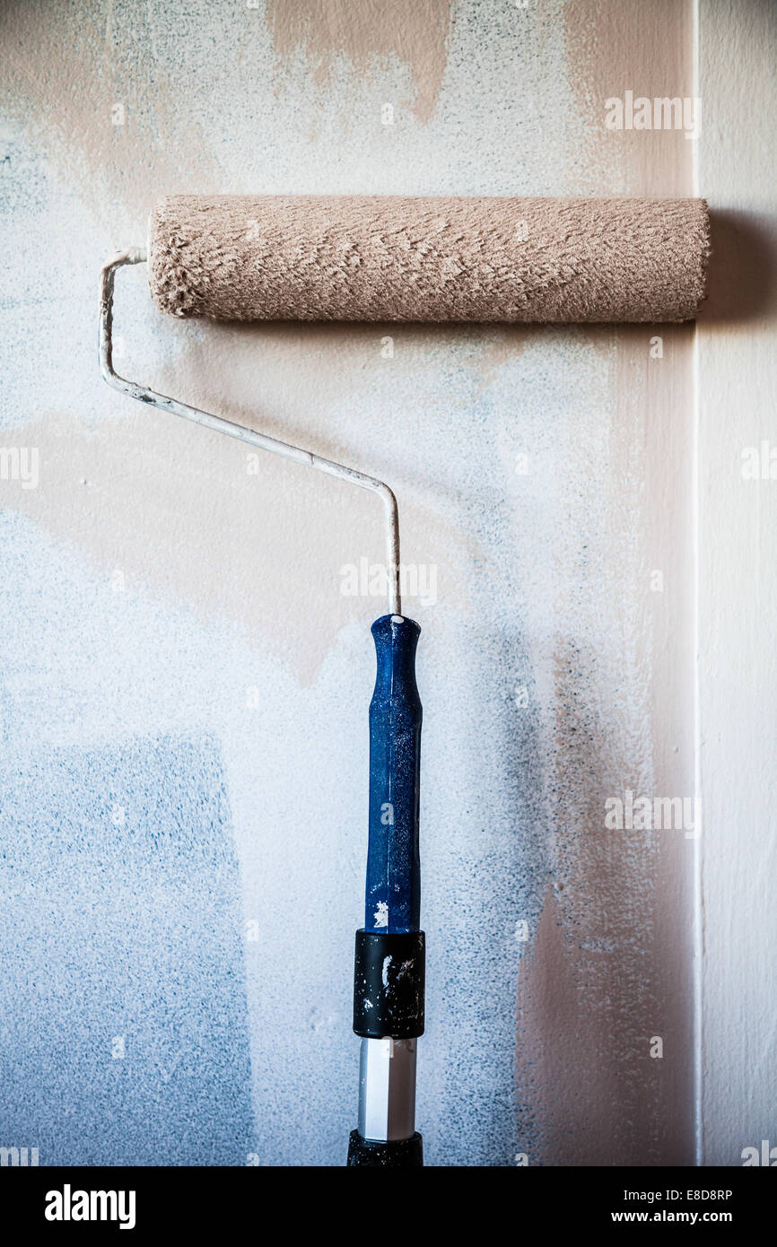 Closeup paint roller on wall hi-res stock photography and images - Alamy