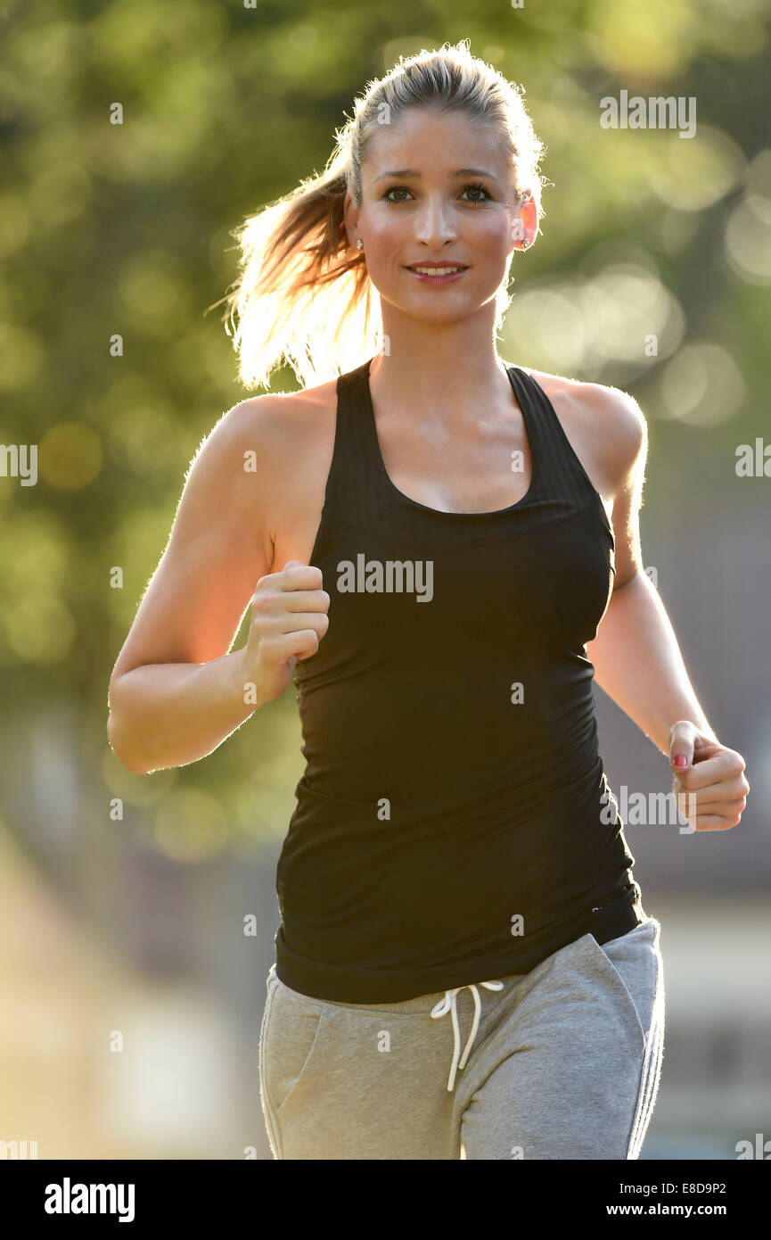 Young woman jogging, Germany Stock Photo - Alamy