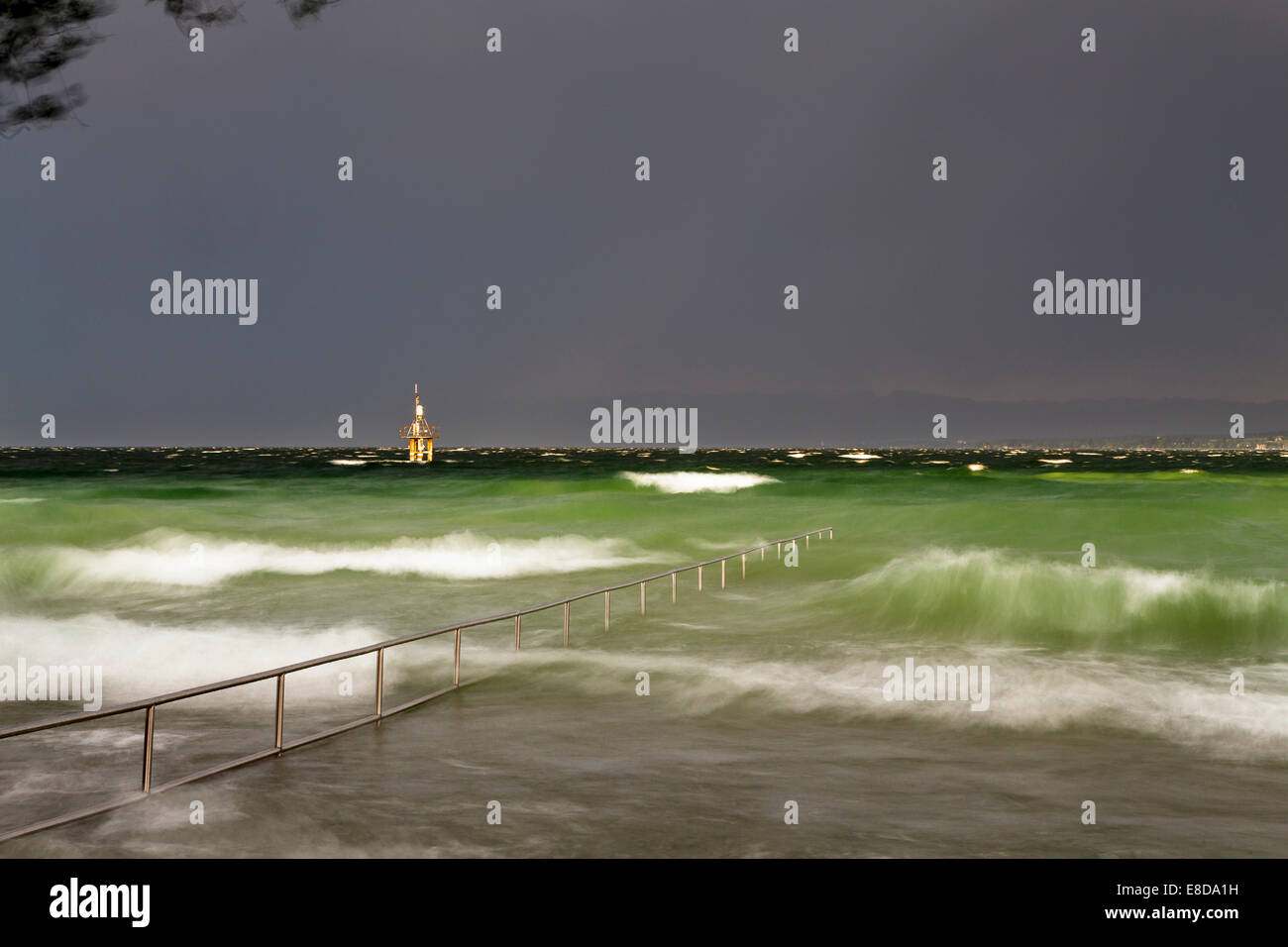 Thunderstorm and high waves at the Horn outdoor pool, rainbow over Lake ...