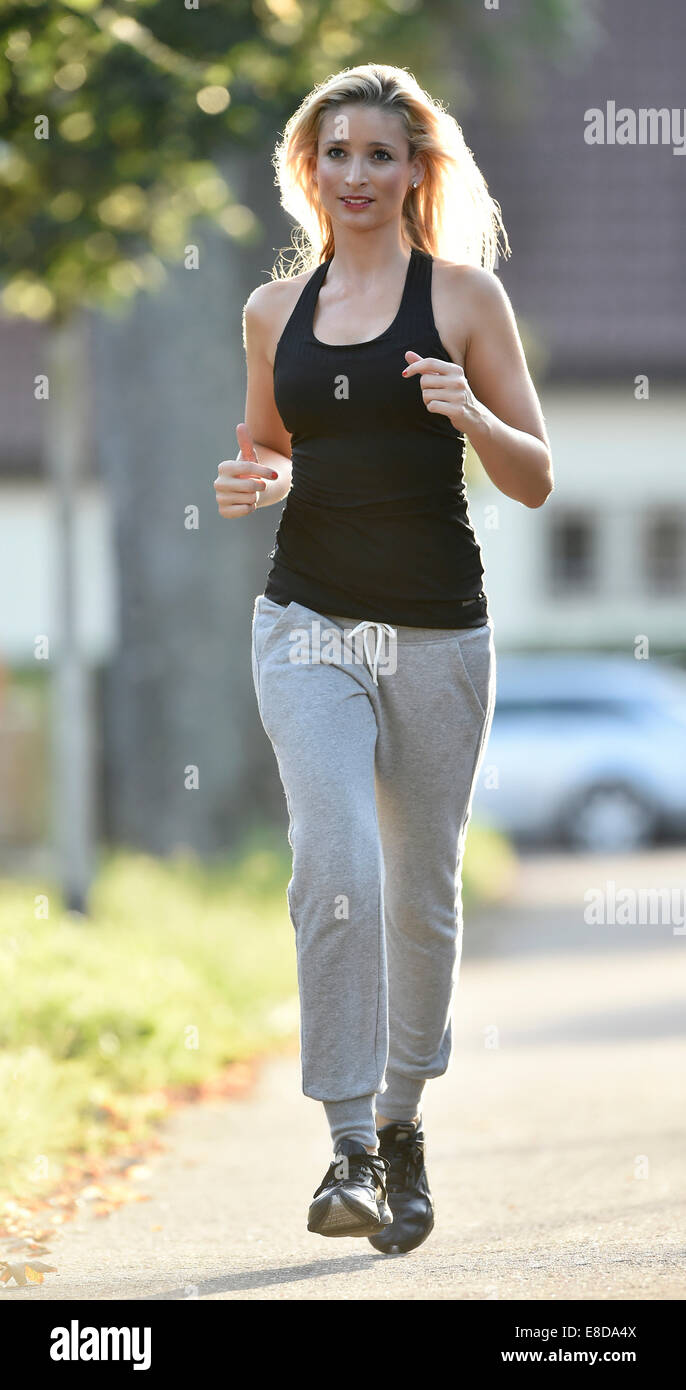 Young woman jogging, Germany Stock Photo - Alamy