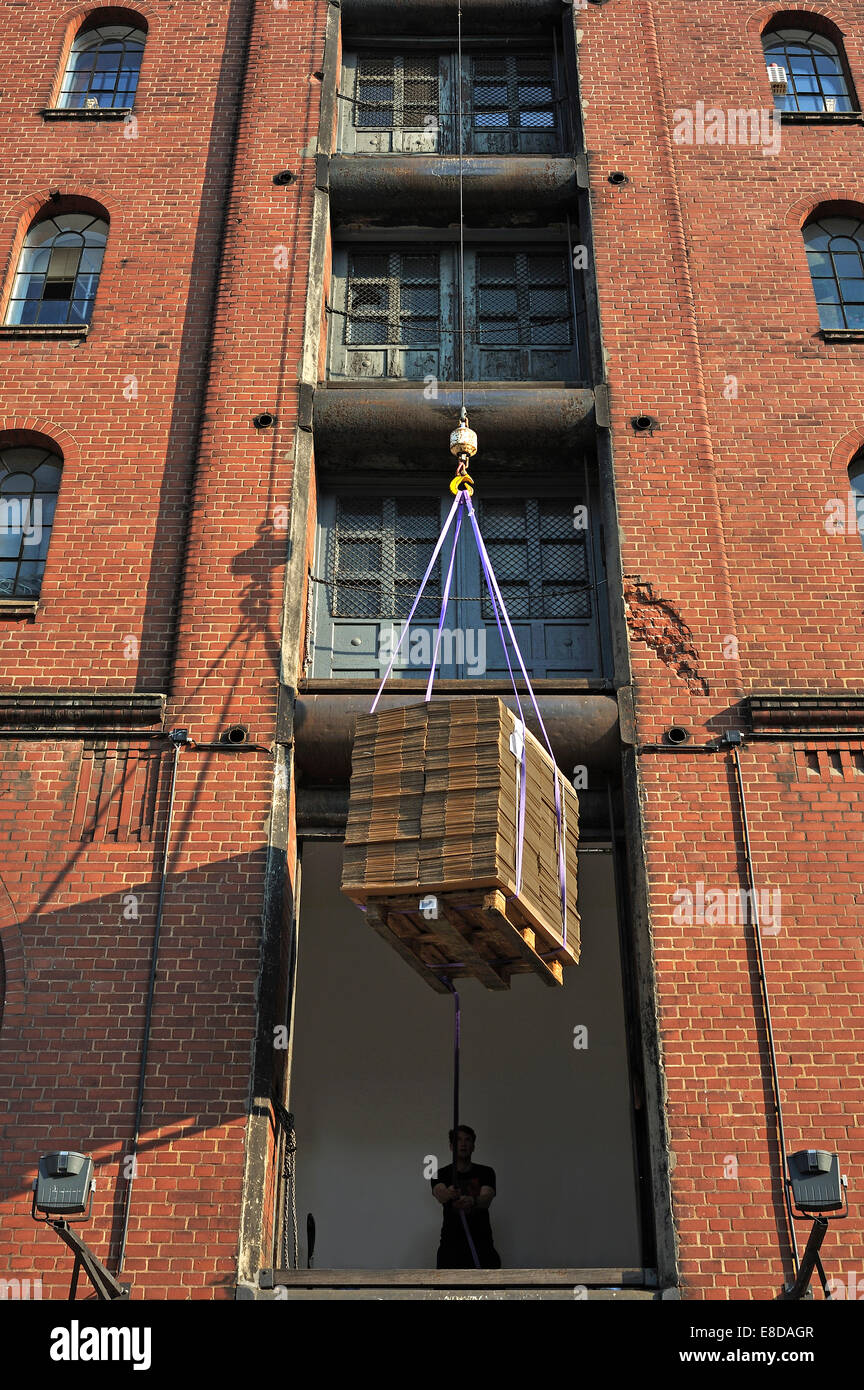 Cardboard boxes are lifted into storage, storehouse in the ...