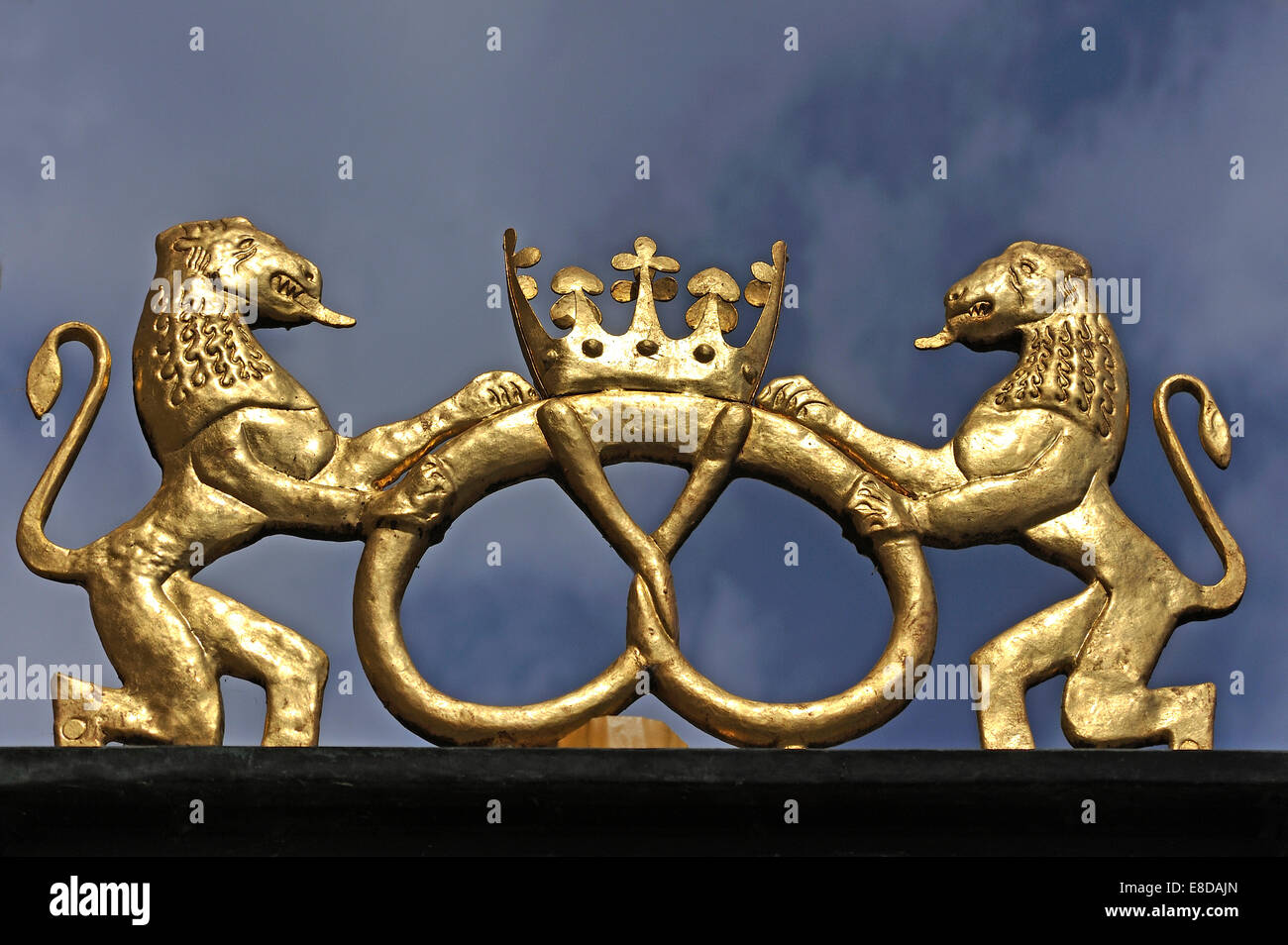 Golden lion sculptures with pretzel, guild sign of the bakers, before ...