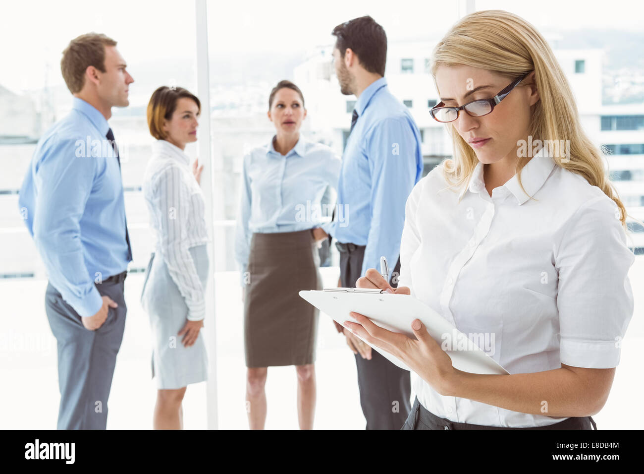 Man standing behind woman writing hi-res stock photography and images ...
