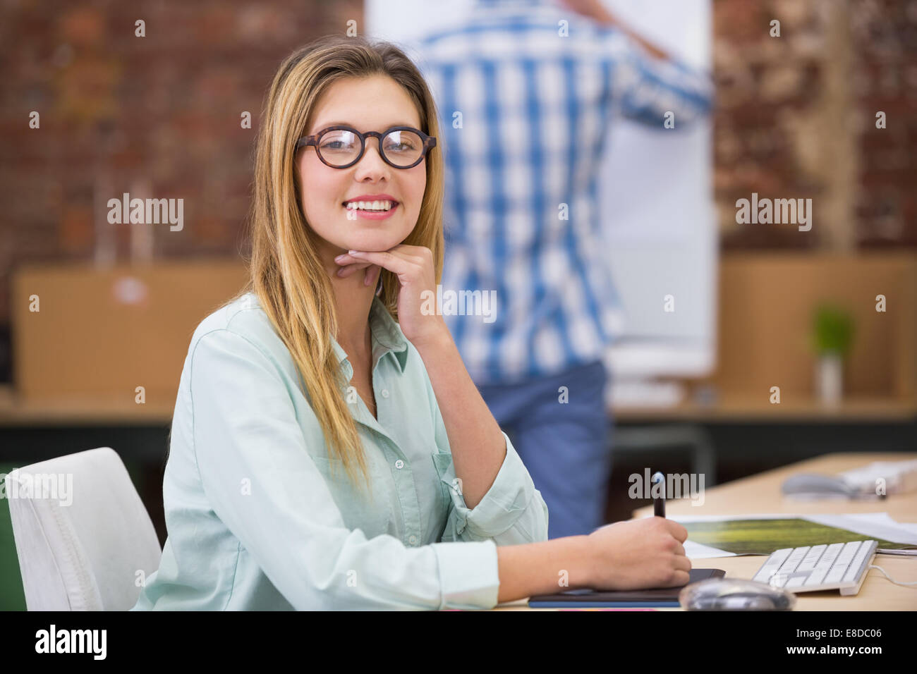 Female photo editor using digitizer in office Stock Photo - Alamy