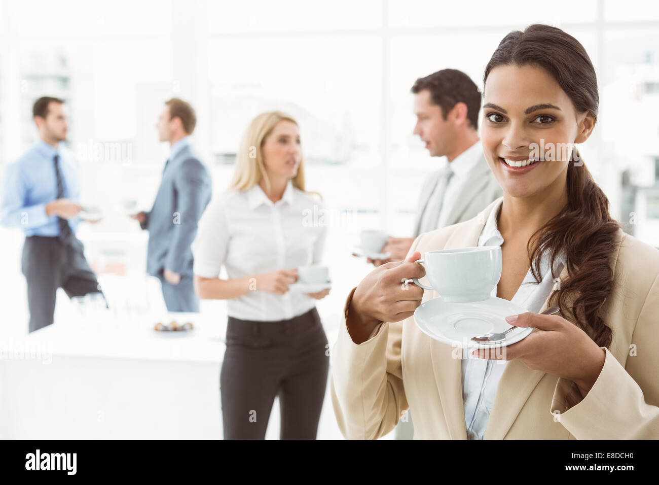Work team during break time in office Stock Photo - Alamy
