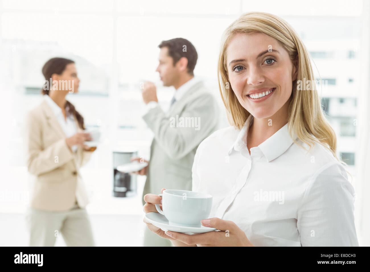 Work team during break time in office Stock Photo - Alamy