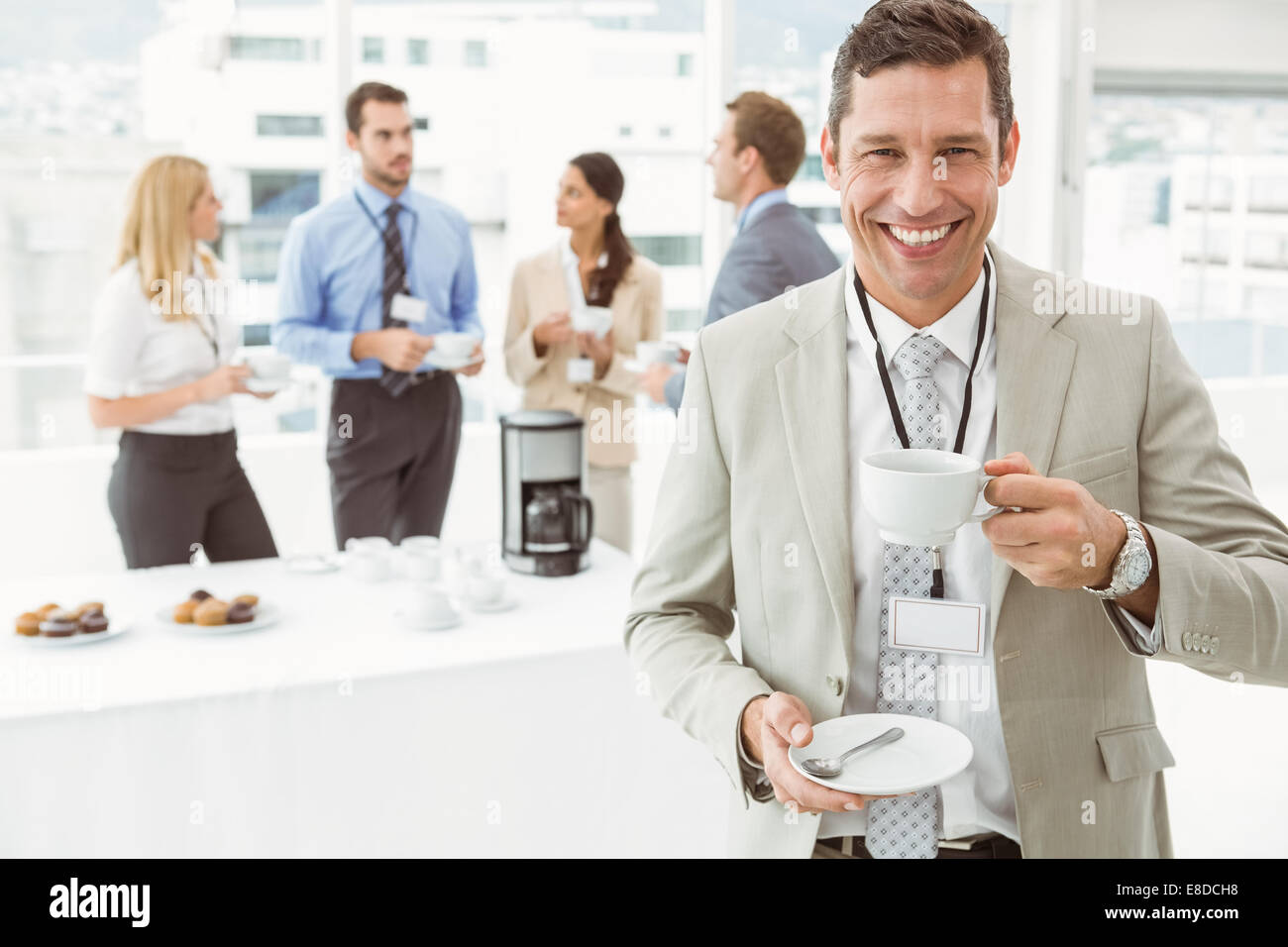 Work team during break time in office Stock Photo - Alamy