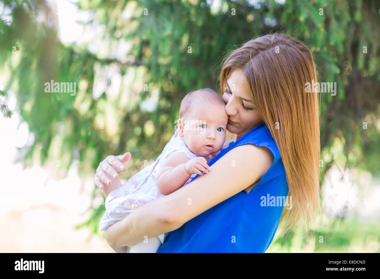 Beautiful Mother And Baby outdoors. Nature. Beauty Mum and her Child ...