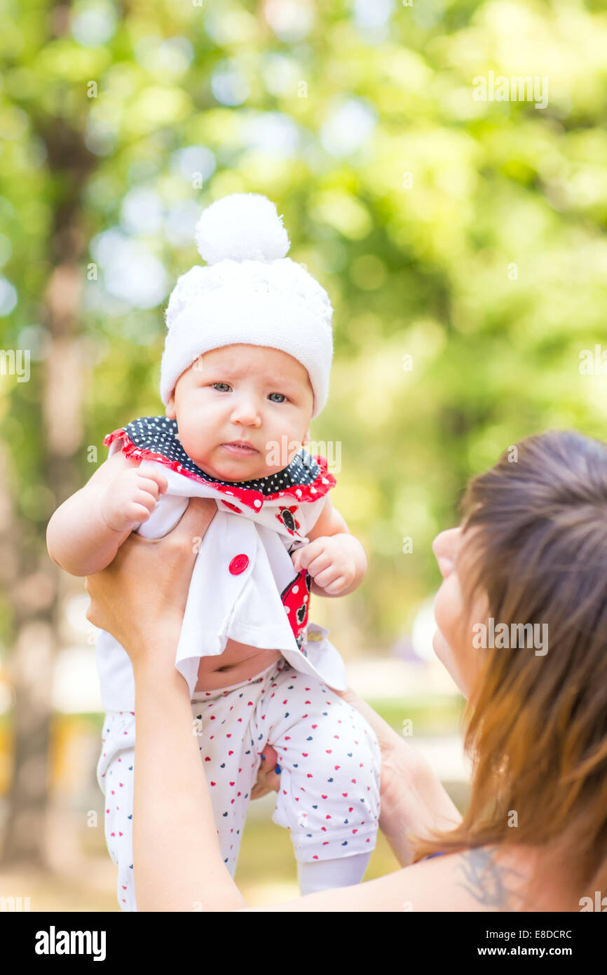 Beautiful Mother And Baby outdoors. Nature. Beauty Mum and her Child ...