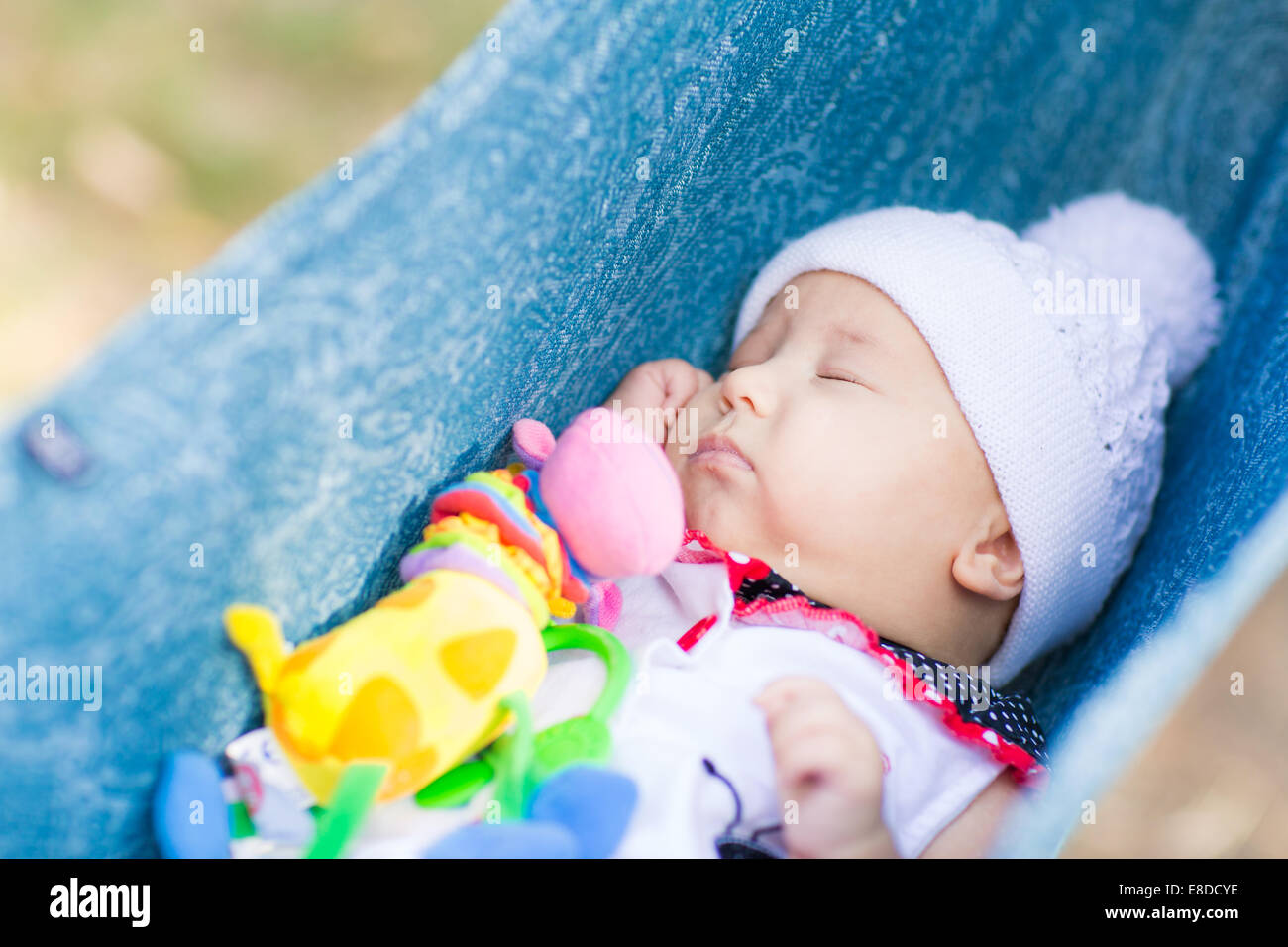 Cute little baby sleeping in the park outdoor on the grass Stock Photo ...