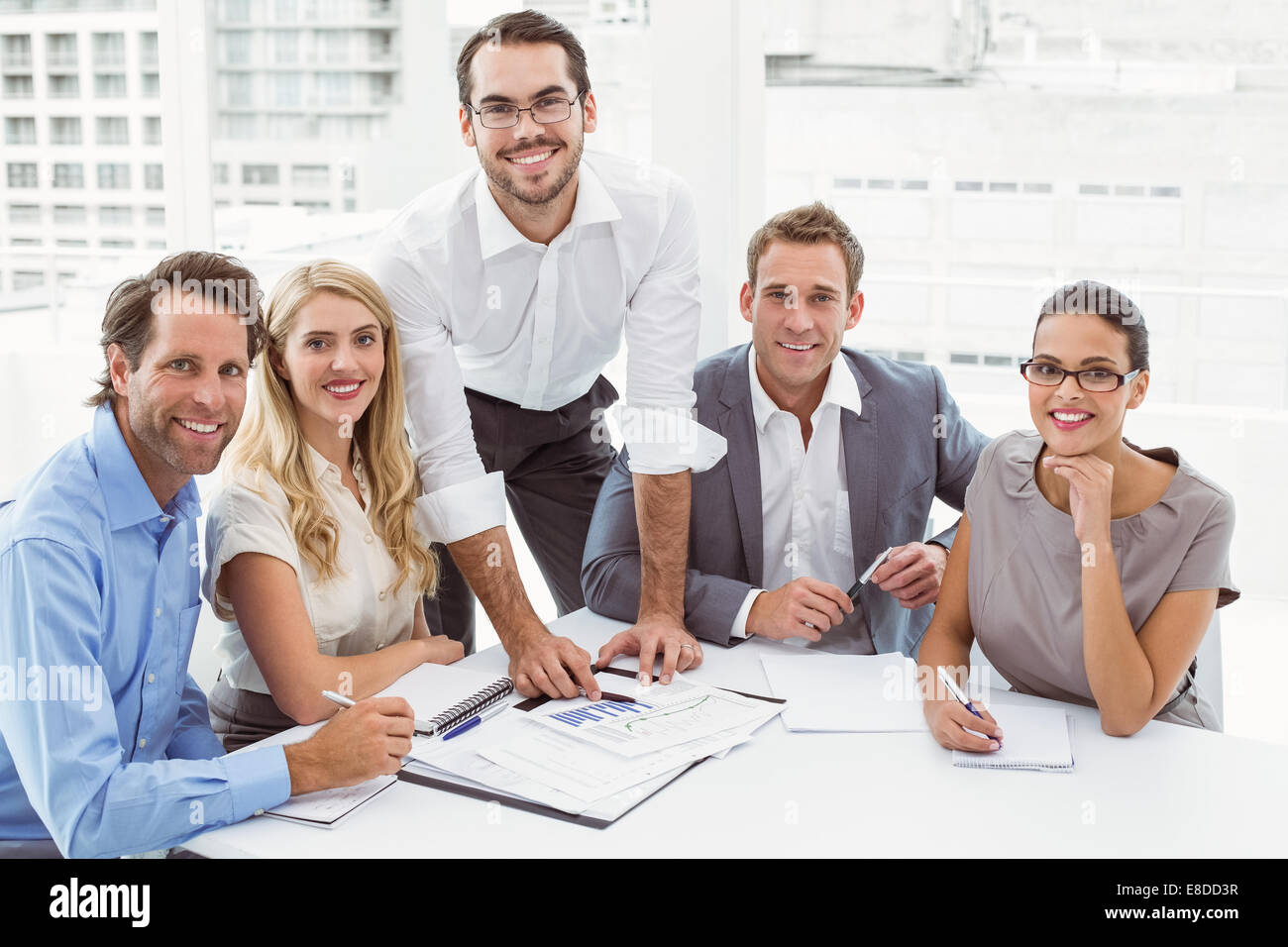 Business people writing notes in office Stock Photo - Alamy