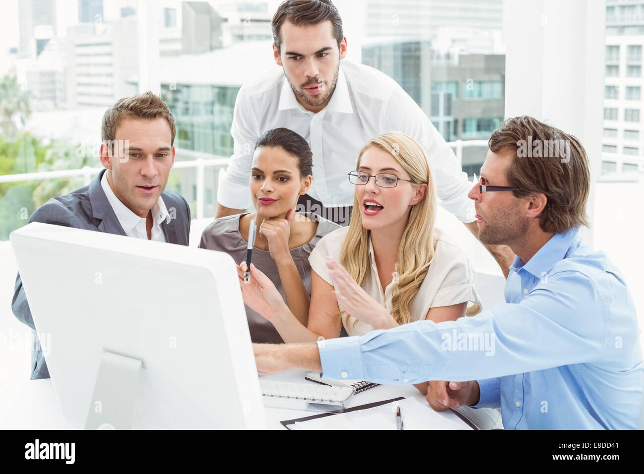 Business people using laptop in meeting Stock Photo - Alamy