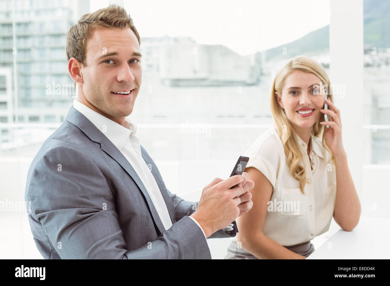 Business people using mobile phones Stock Photo - Alamy