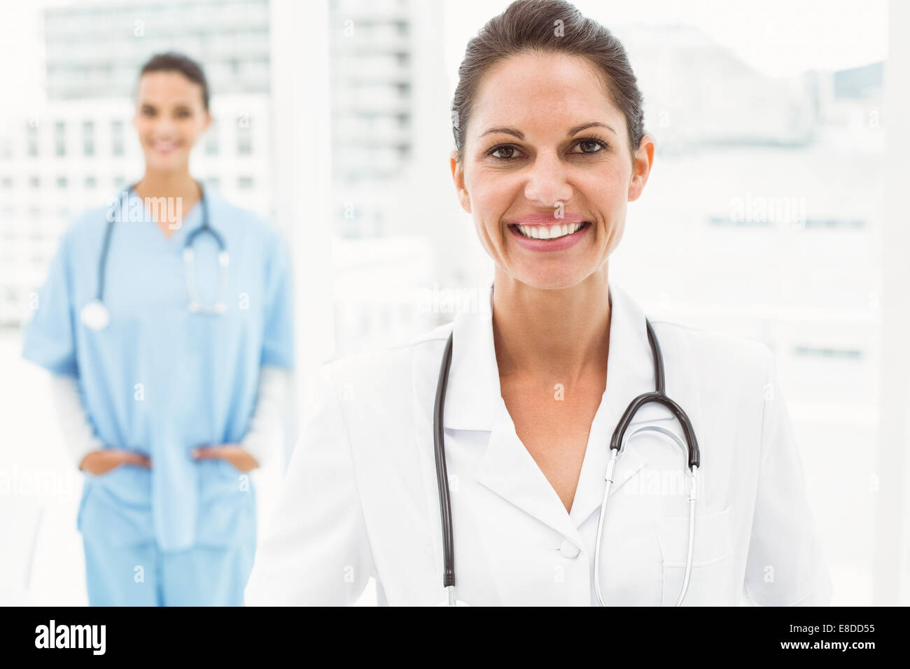 Portrait of a smiling confident female doctor Stock Photo - Alamy
