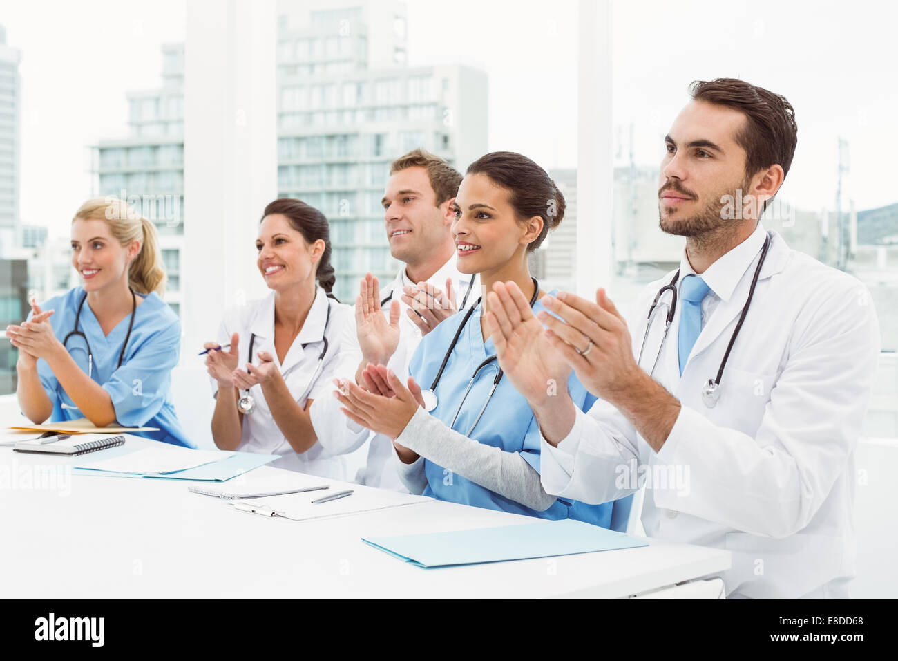Doctors clapping hands in meeting Stock Photo - Alamy