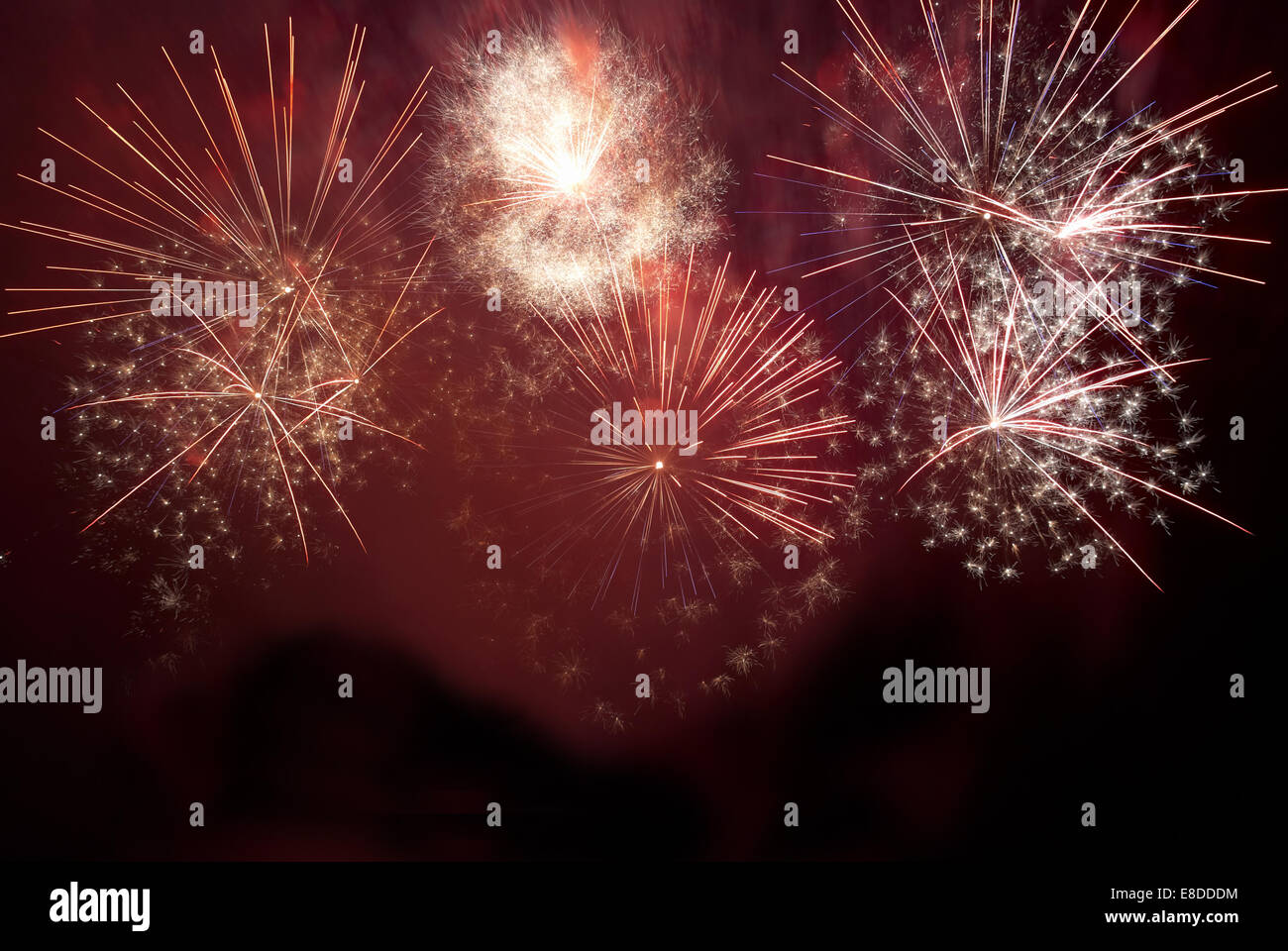 Red colorful fireworks on the black sky background. Holiday celebration ...