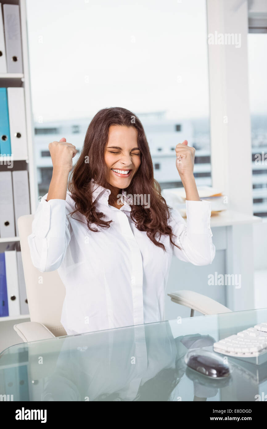 Elegant businesswoman cheering office desk hi-res stock photography and ...