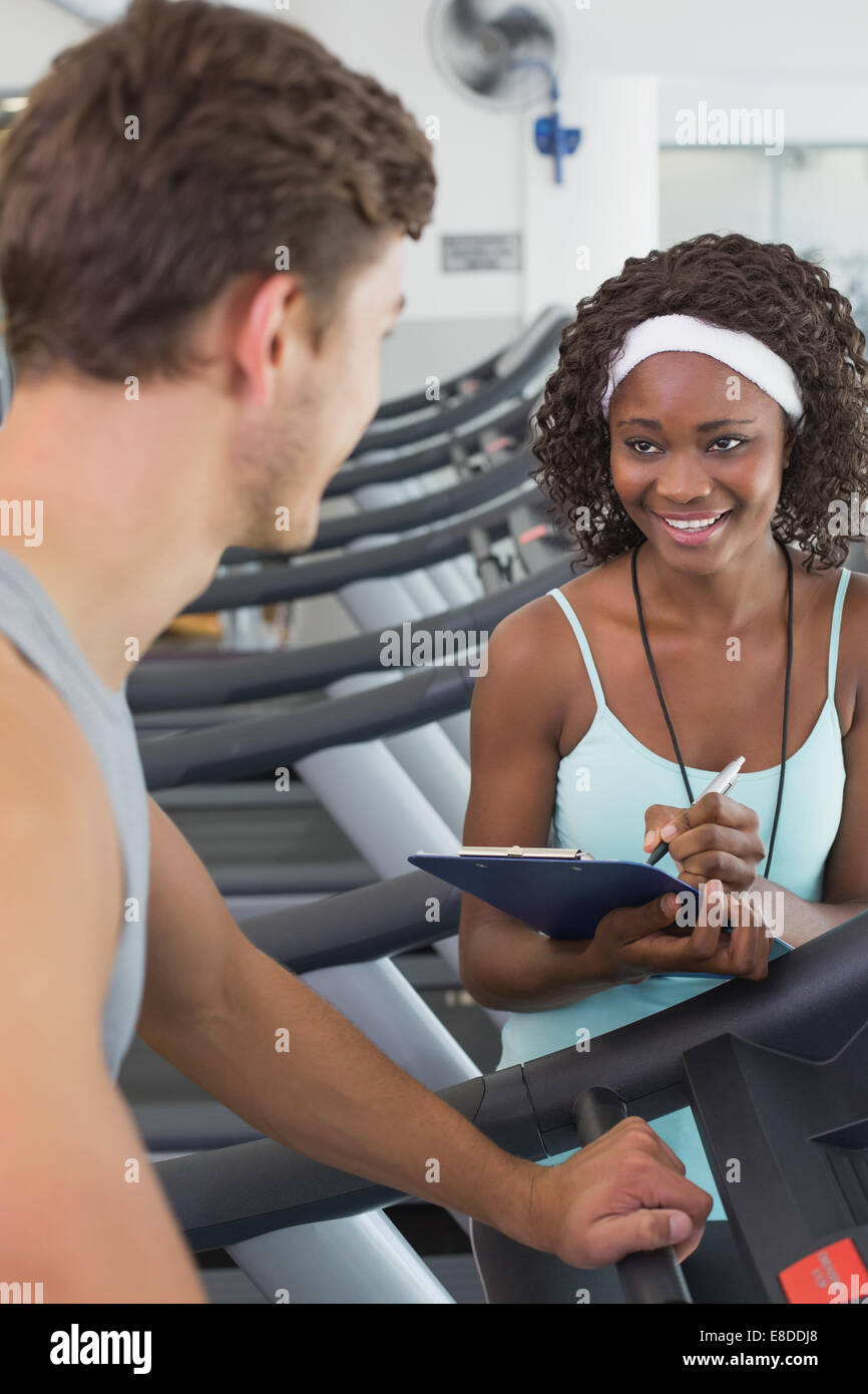 Sports woman personal trainer talking hi-res stock photography and ...