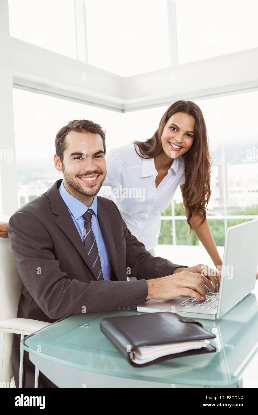 Business people using laptop in office Stock Photo - Alamy