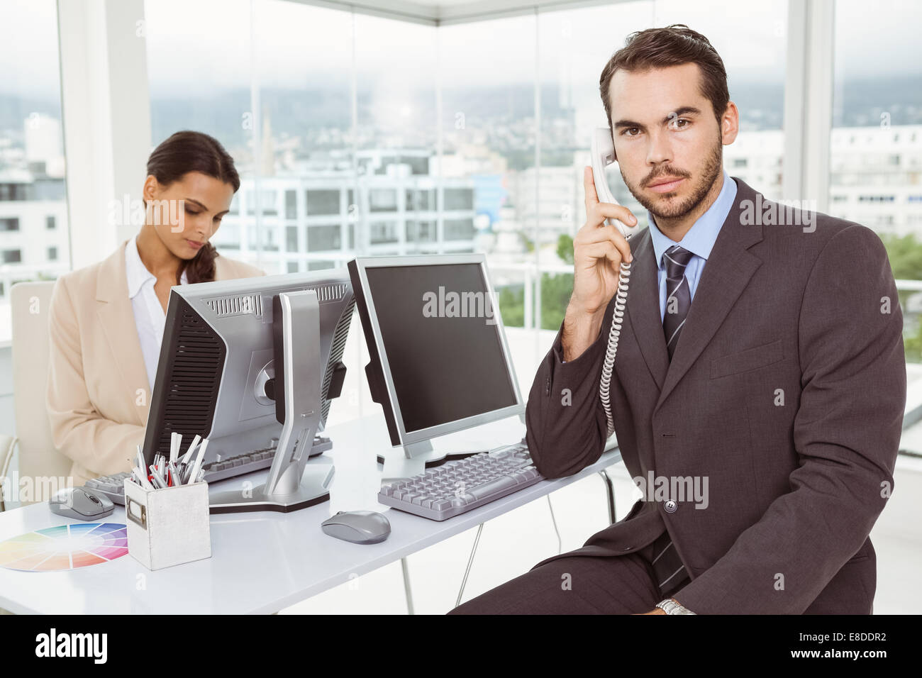 Business people using computers in office Stock Photo - Alamy