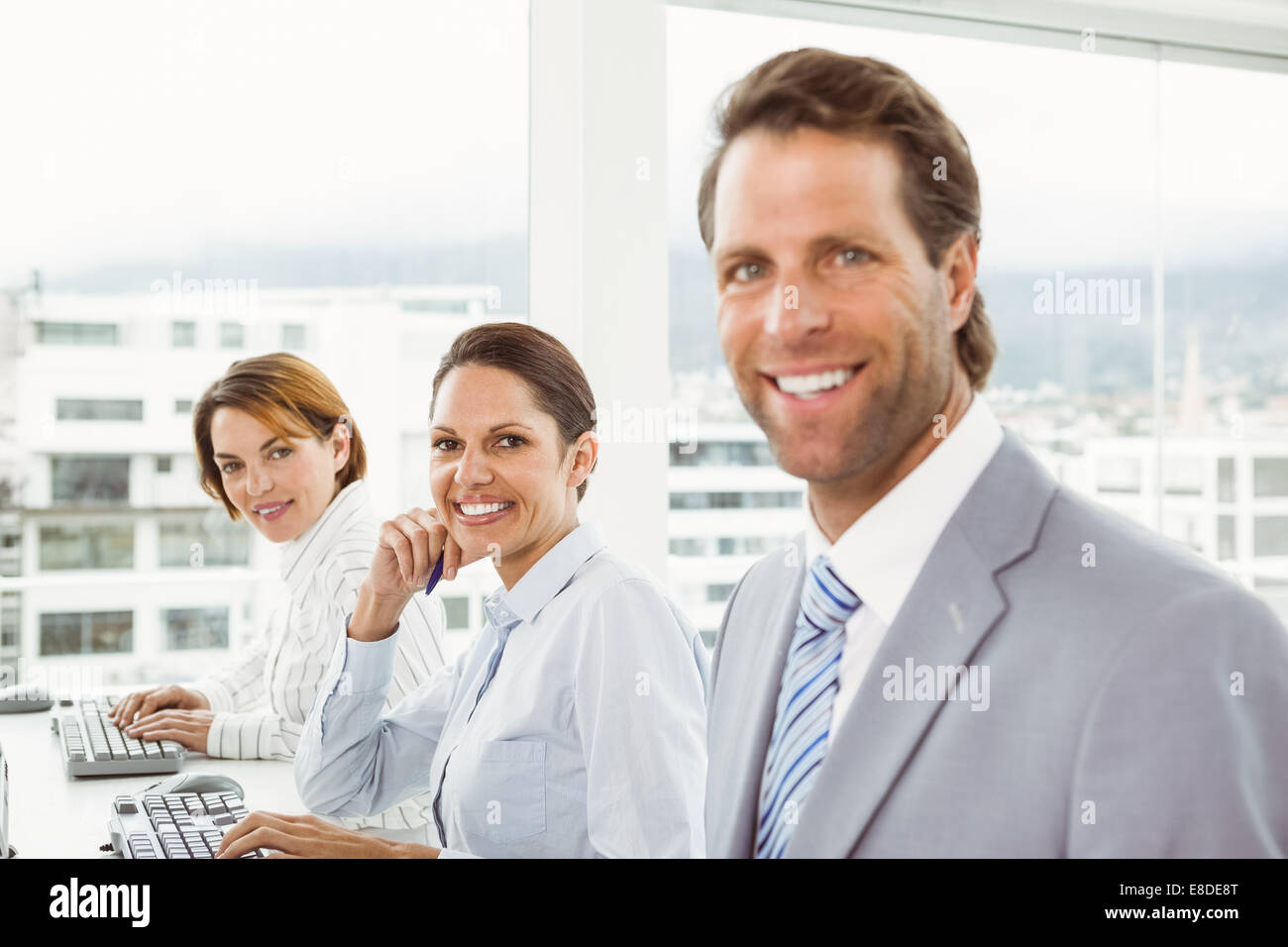 Business people using computers in office Stock Photo - Alamy