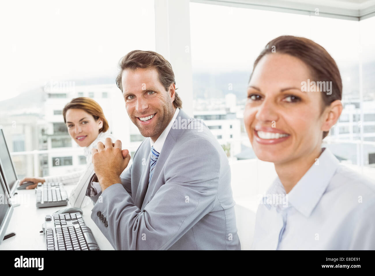 Business people using computers in office Stock Photo - Alamy