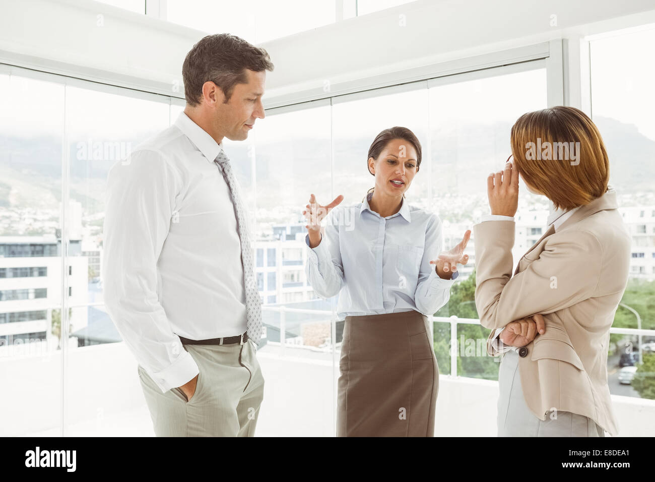 Business colleagues in discussion at office Stock Photo - Alamy