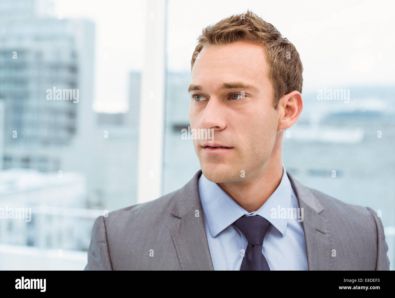 Smart young businessman in suit Stock Photo - Alamy
