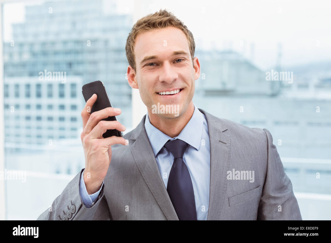 Portrait of businessman using mobile phone Stock Photo - Alamy