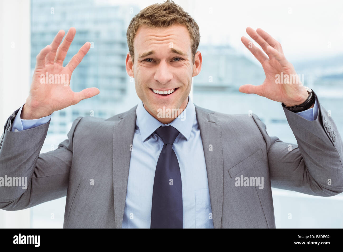 Angry young businessman at office Stock Photo - Alamy
