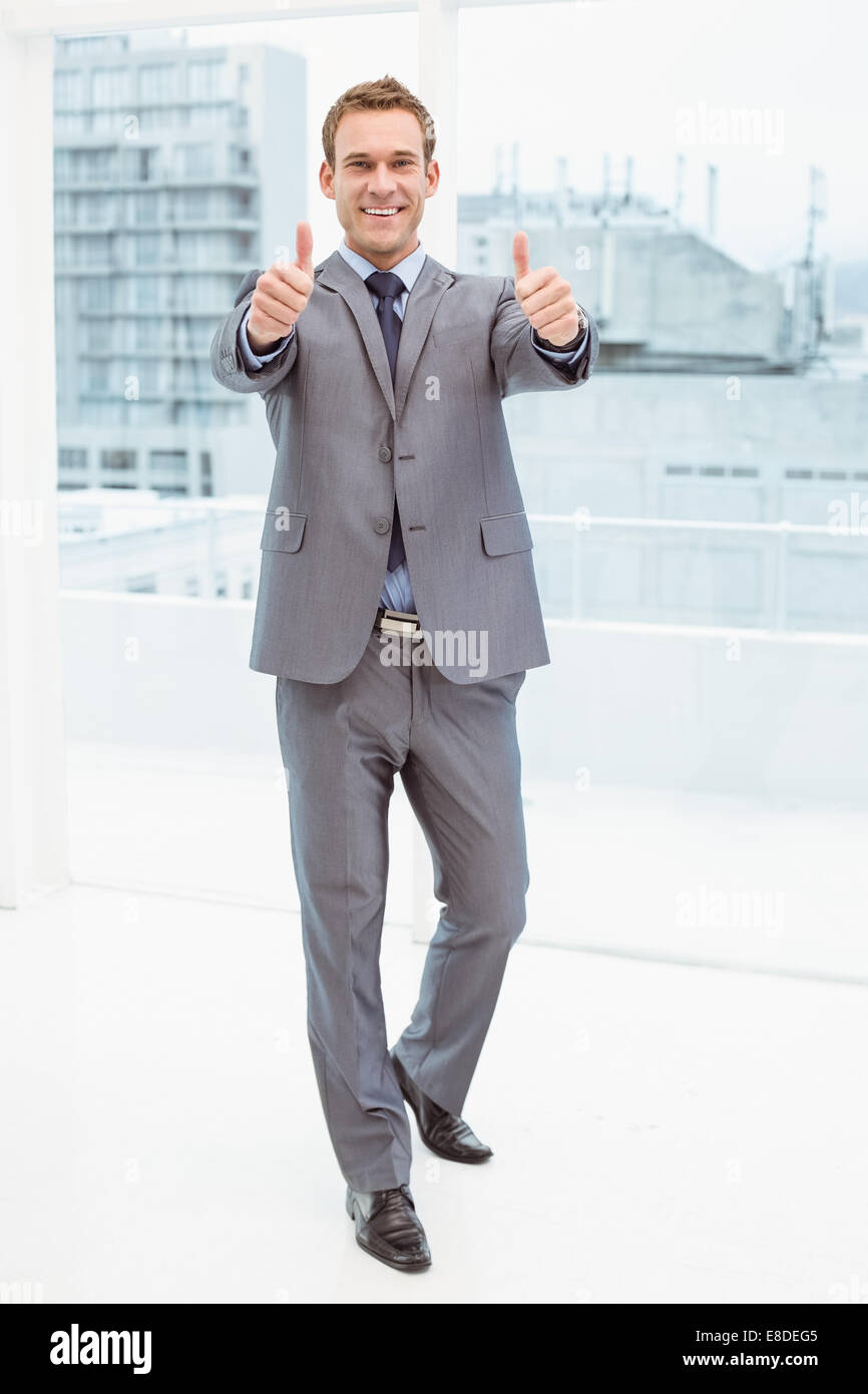 Businessman gesturing thumbs up in office Stock Photo - Alamy Businessman gesturing thumbs up in office Stock Photo - Alamy