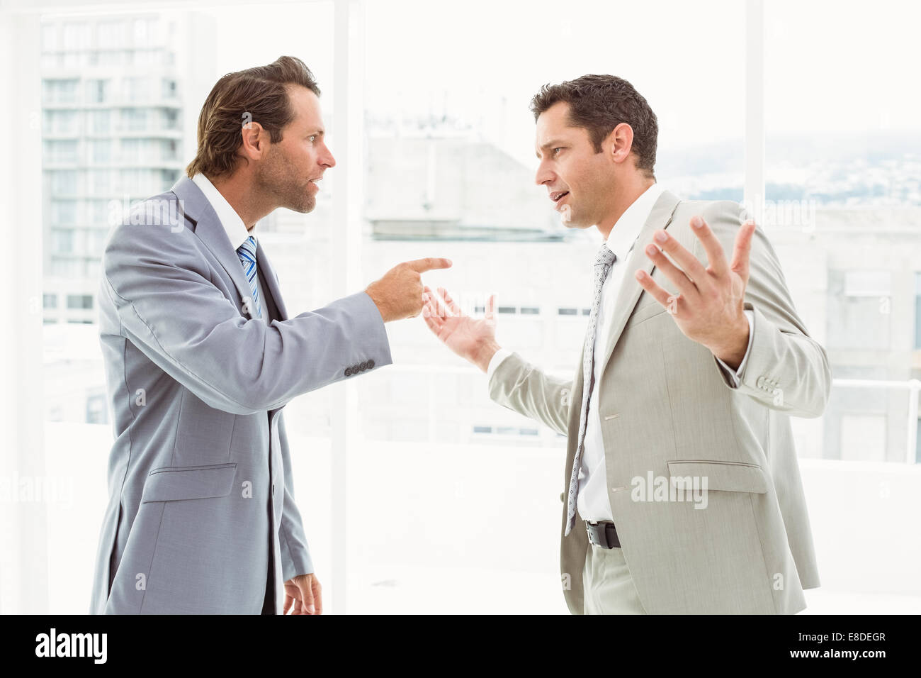 Business partners fighting in hi-res stock photography and images - Alamy
