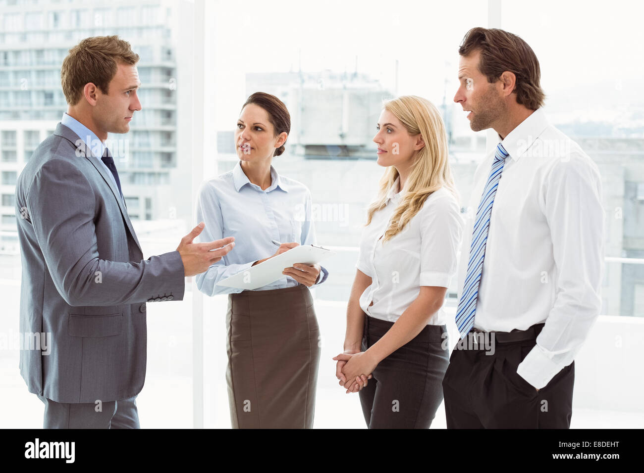 Young beautiful businesswoman listening colleagues hi-res stock ...