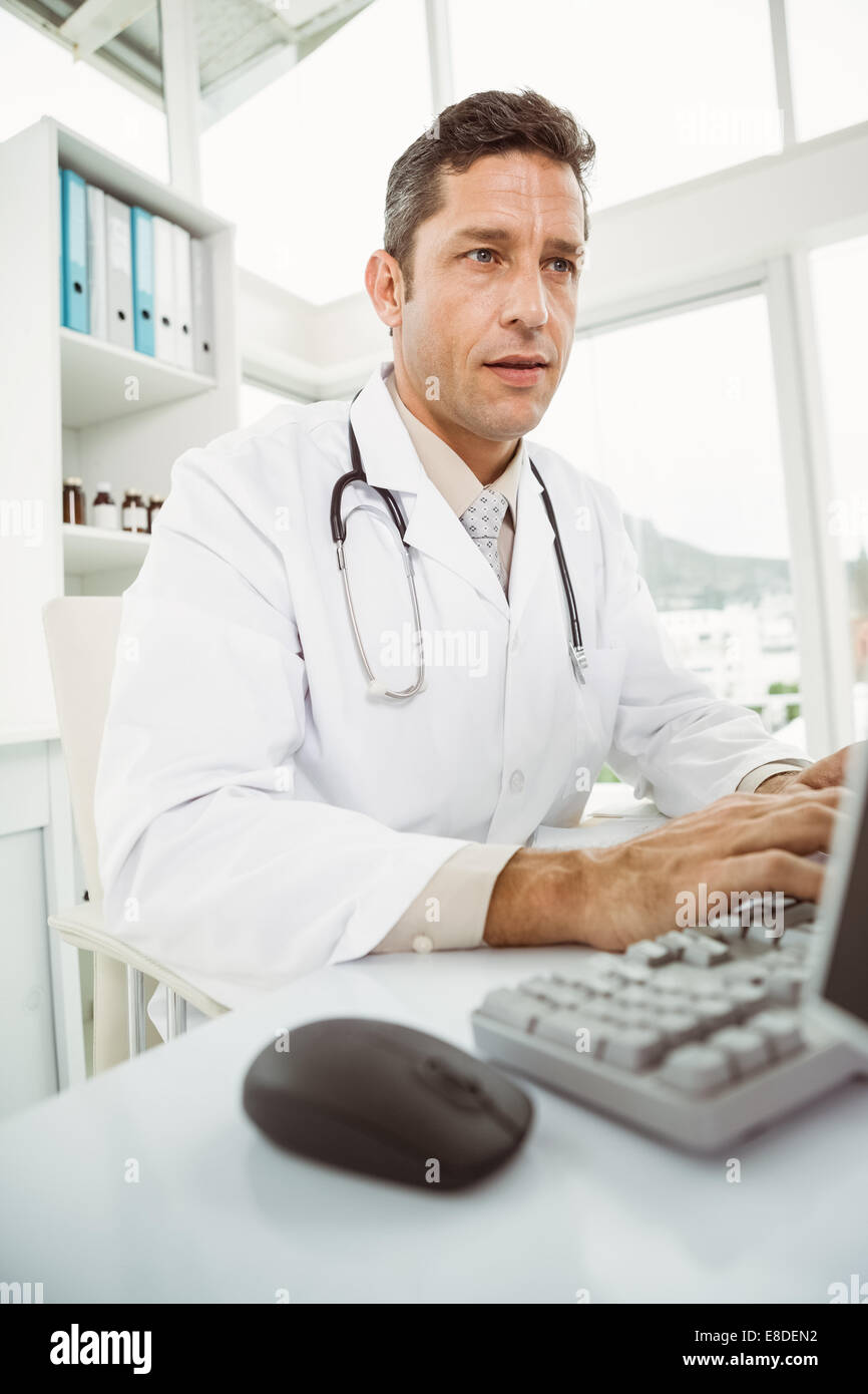 Doctor using computer at medical office Stock Photo - Alamy