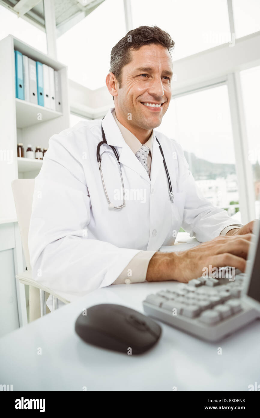 Doctor using computer at medical office Stock Photo - Alamy