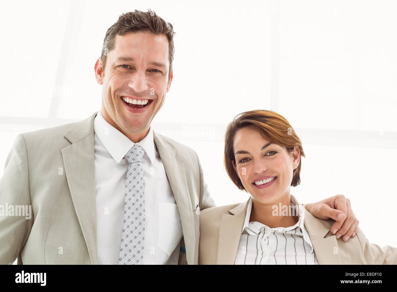Happy business couple in office Stock Photo - Alamy
