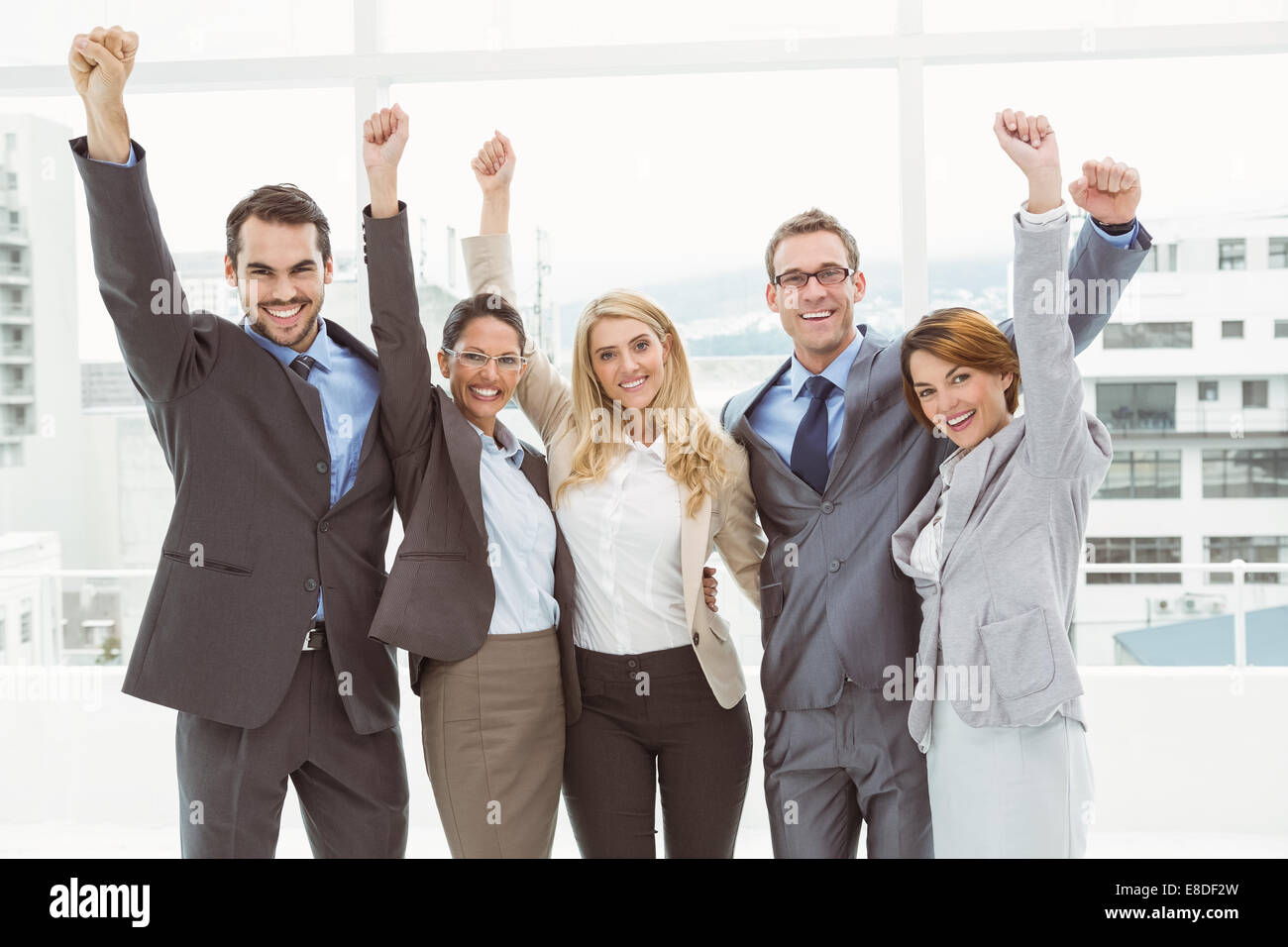 Business people cheering in office Stock Photo - Alamy