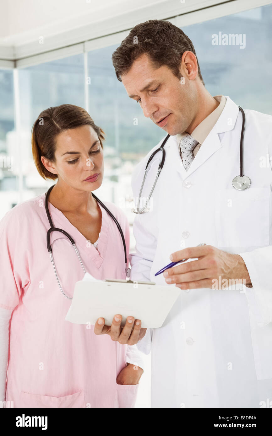 Male doctors discussing reports hi-res stock photography and images - Alamy