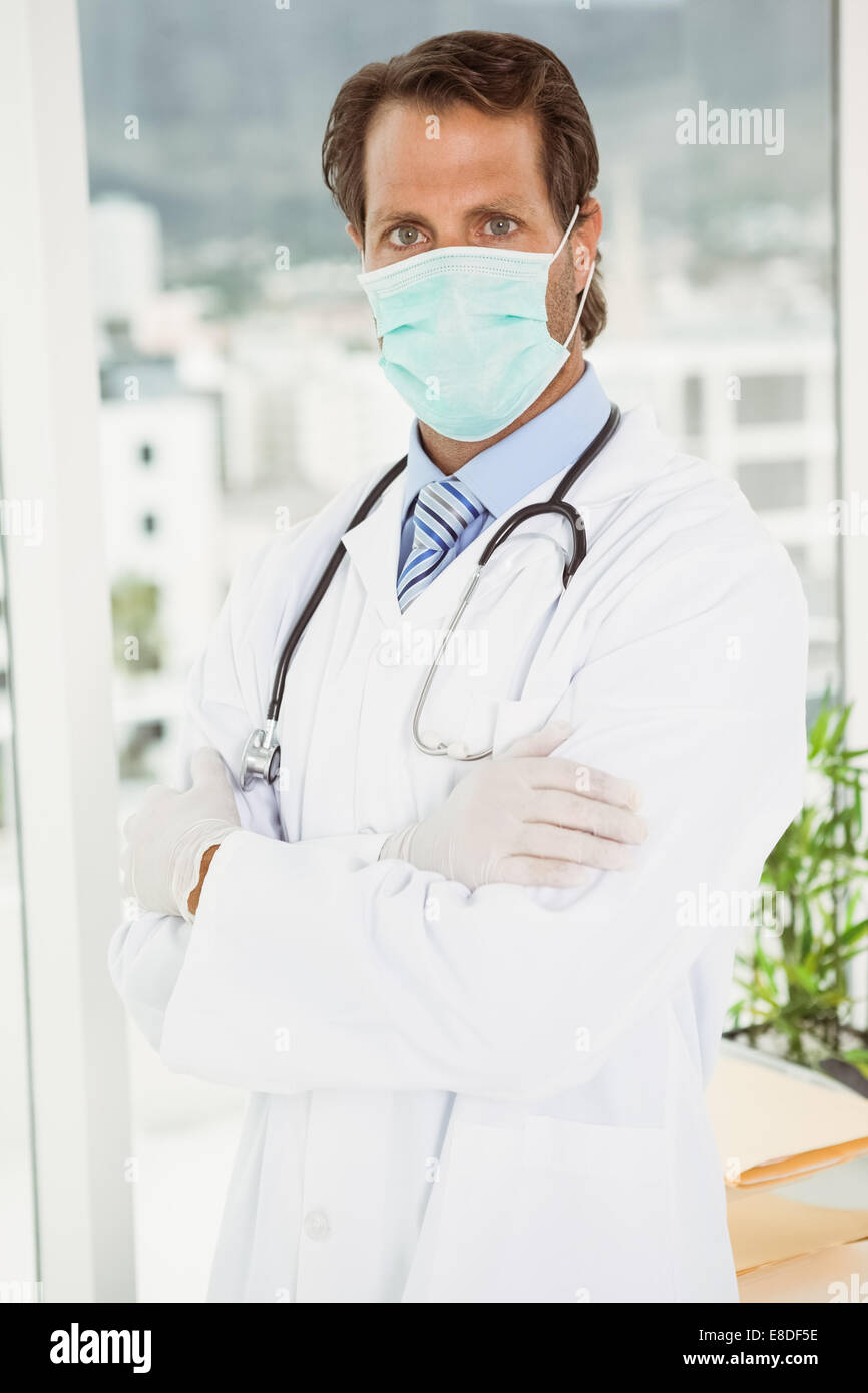 Doctor wearing surgical mask in hospital Stock Photo - Alamy