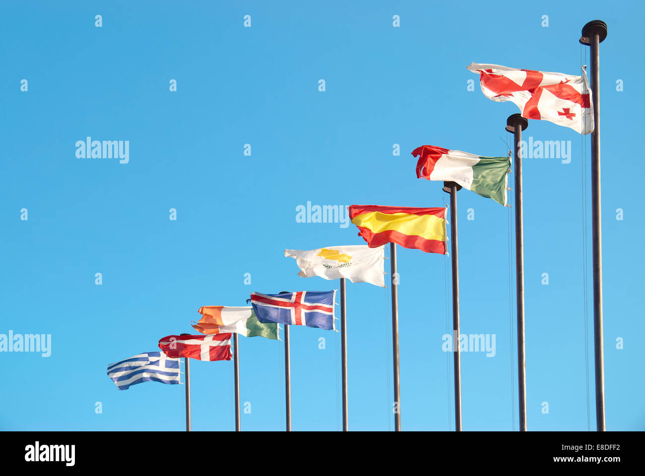 Row of european flags against blue sky background Stock Photo - Alamy